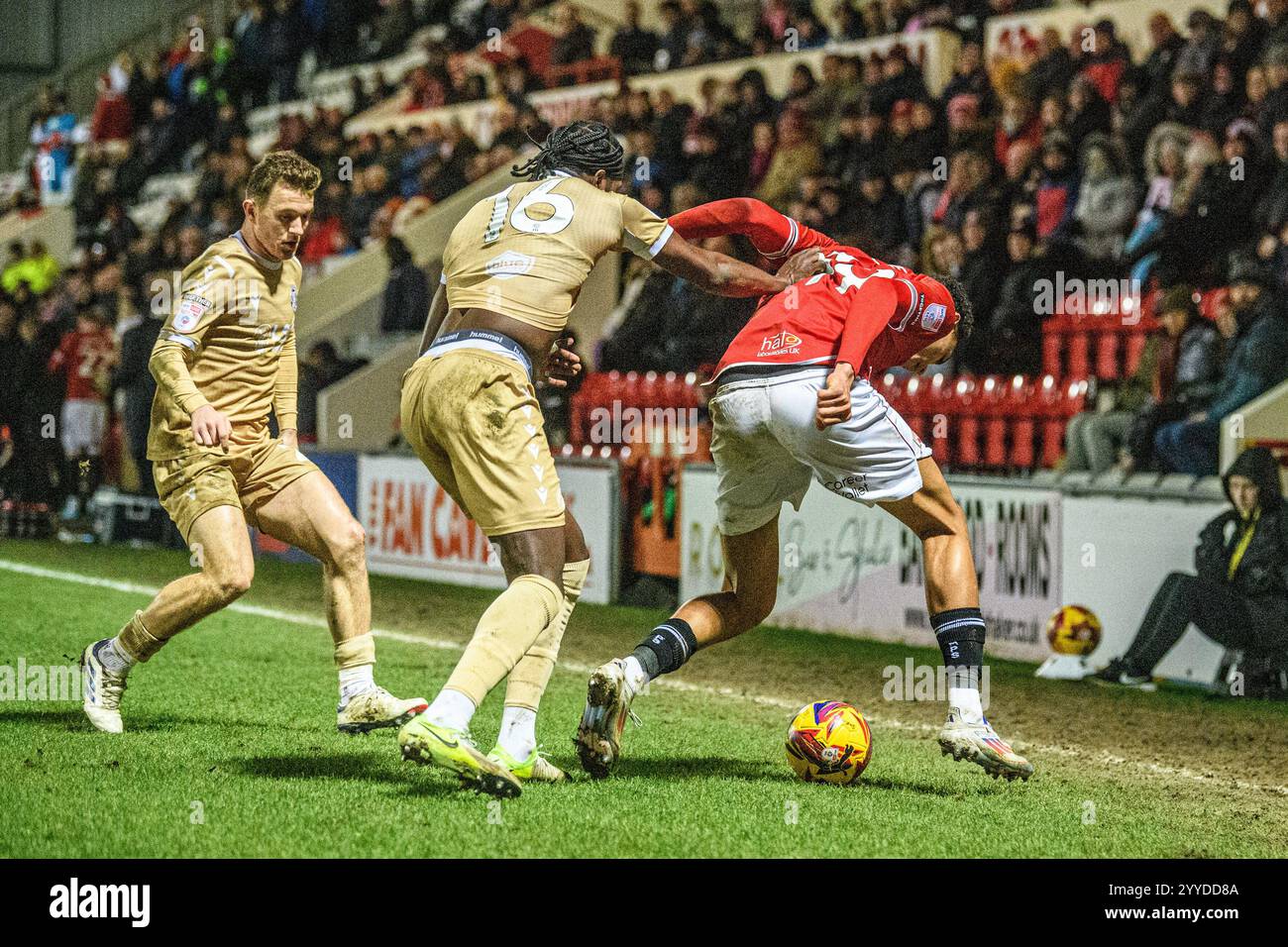 Kamarl Grant of Bromley FC tackles Morecambe FC's Marcus Dackers during ...