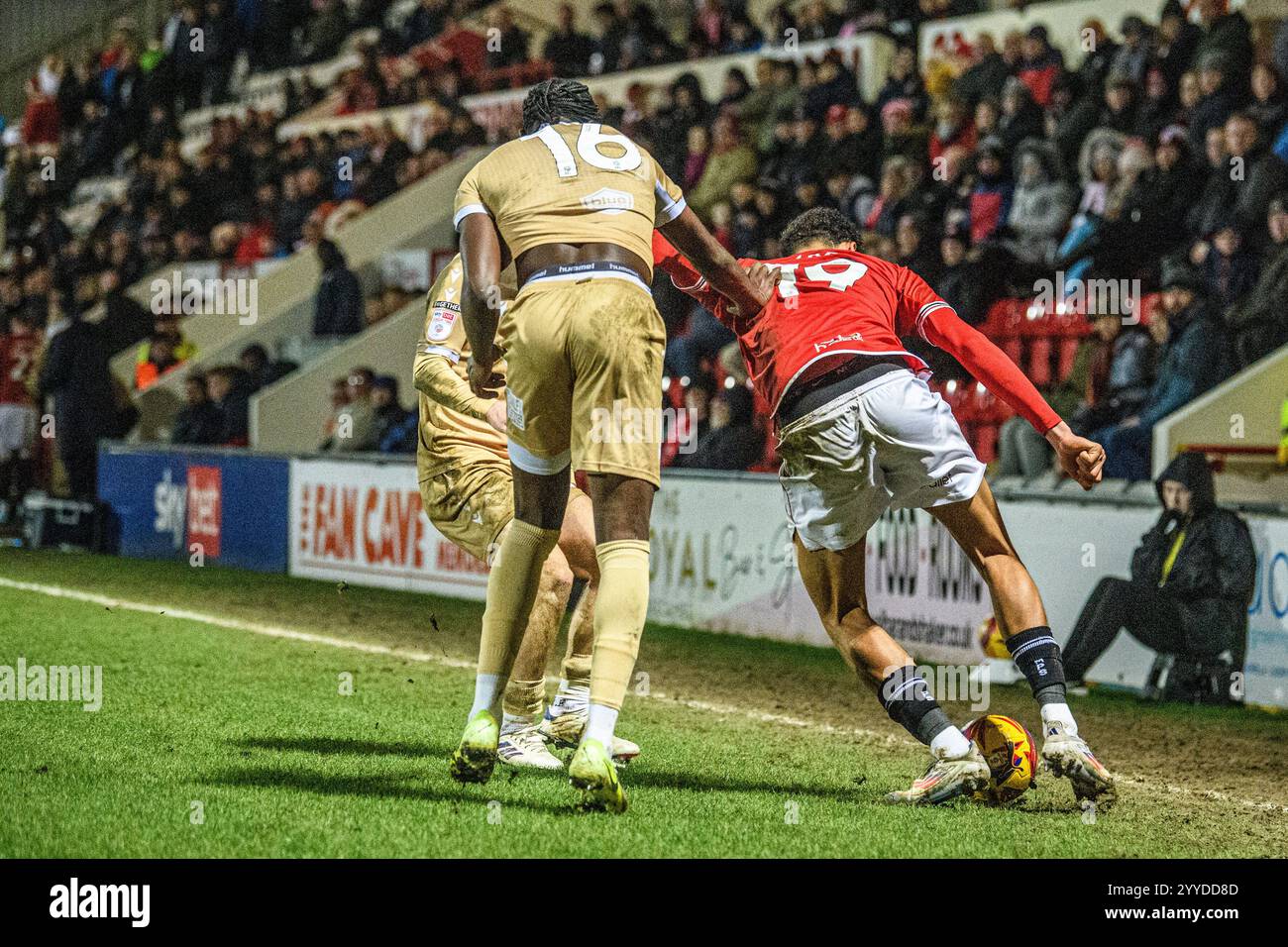 Kamarl Grant of Bromley FC tackles Morecambe FC's Marcus Dackers during ...
