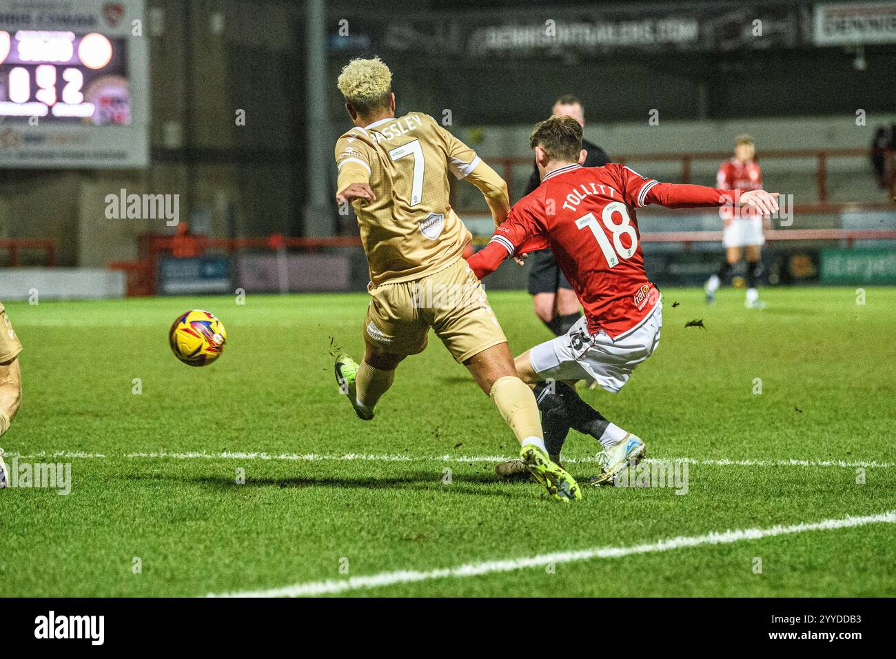 Josh Passley of Bromley FC tackles Morecambe FC's Ben Tollitt during ...