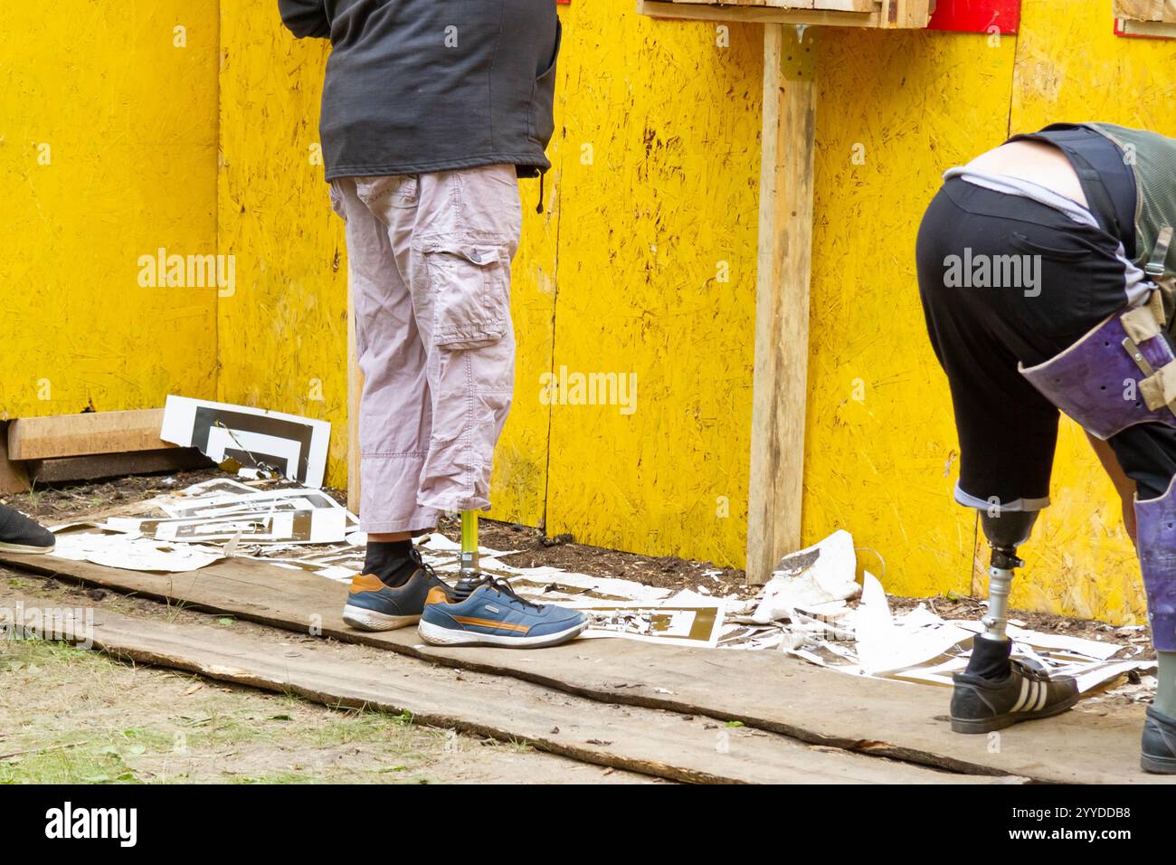 Sports and people with disabilities. A man without a leg throws knives ...