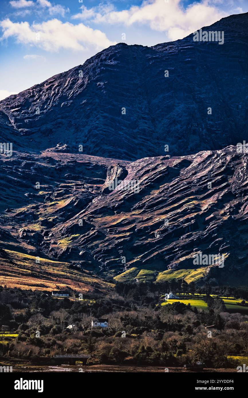 The impressive mountain range showcases dramatic layers of rock ...