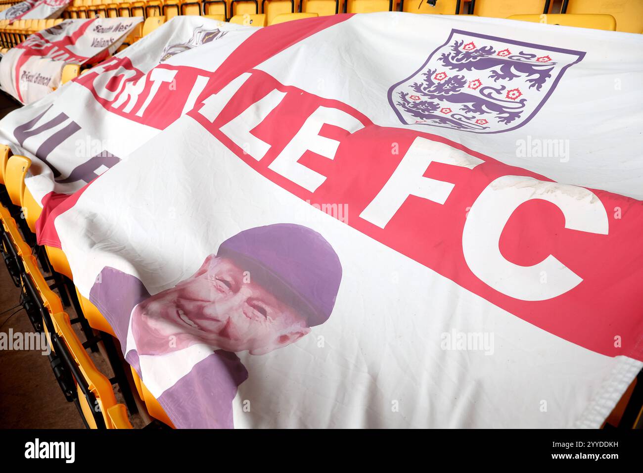 A flag with a picture of former Port Vale manager John Rudge is draped ...