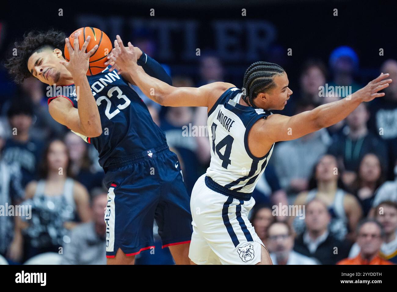 Connecticut forward Jayden Ross (23) is fouled by Butler guard Landon ...