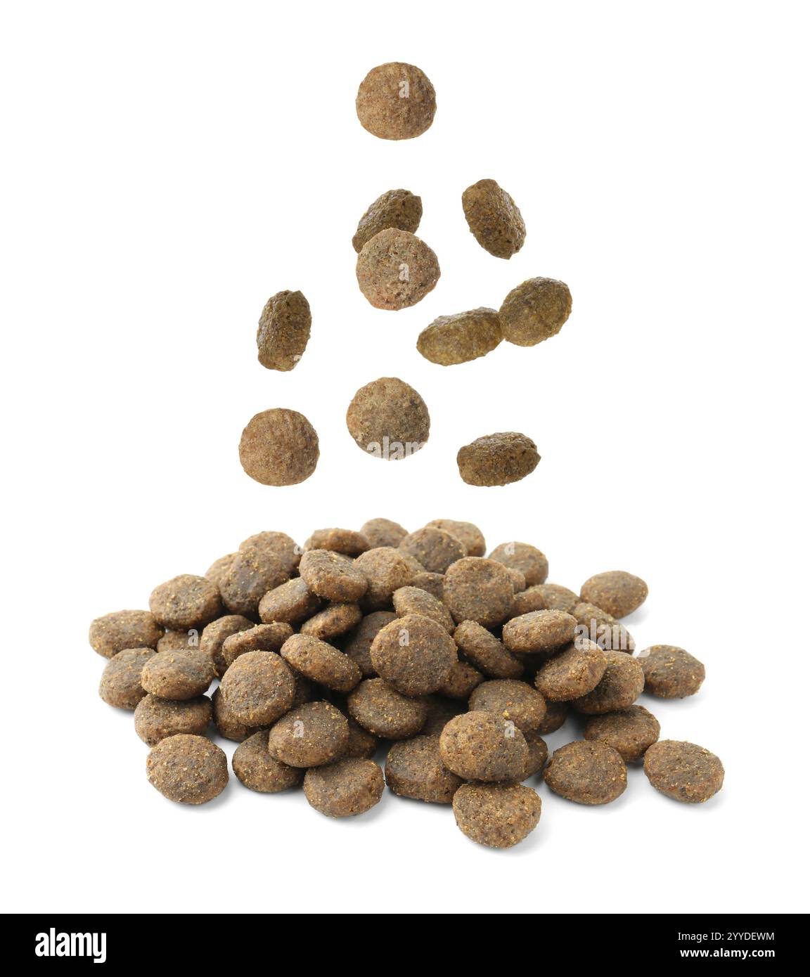 Dry pet food falling onto heap on white background Stock Photo - Alamy