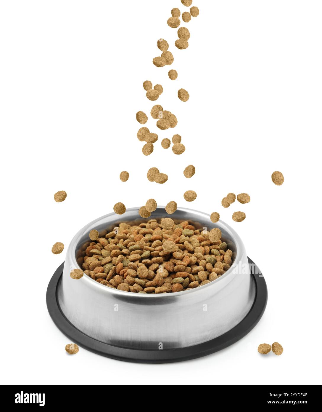 Dry pet food falling into bowl on white background Stock Photo - Alamy