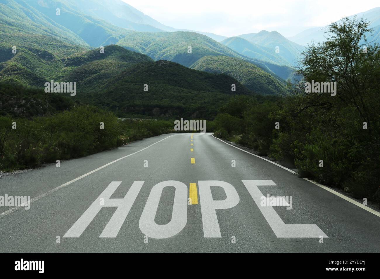 Word Hope on asphalt road leading to mountains Stock Photo - Alamy