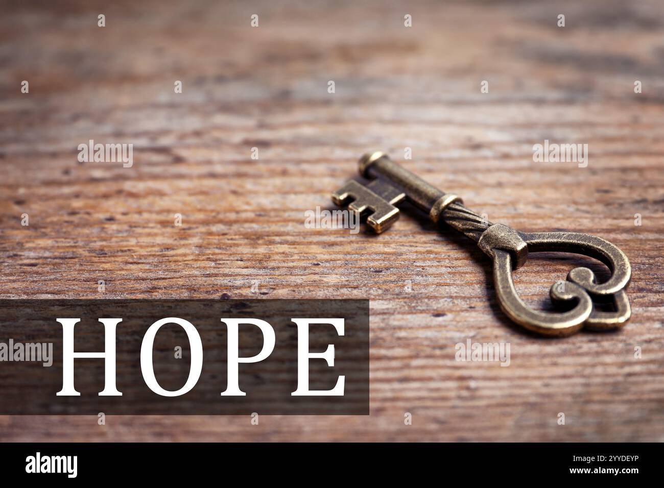Vintage brass key on table hi-res stock photography and images - Alamy