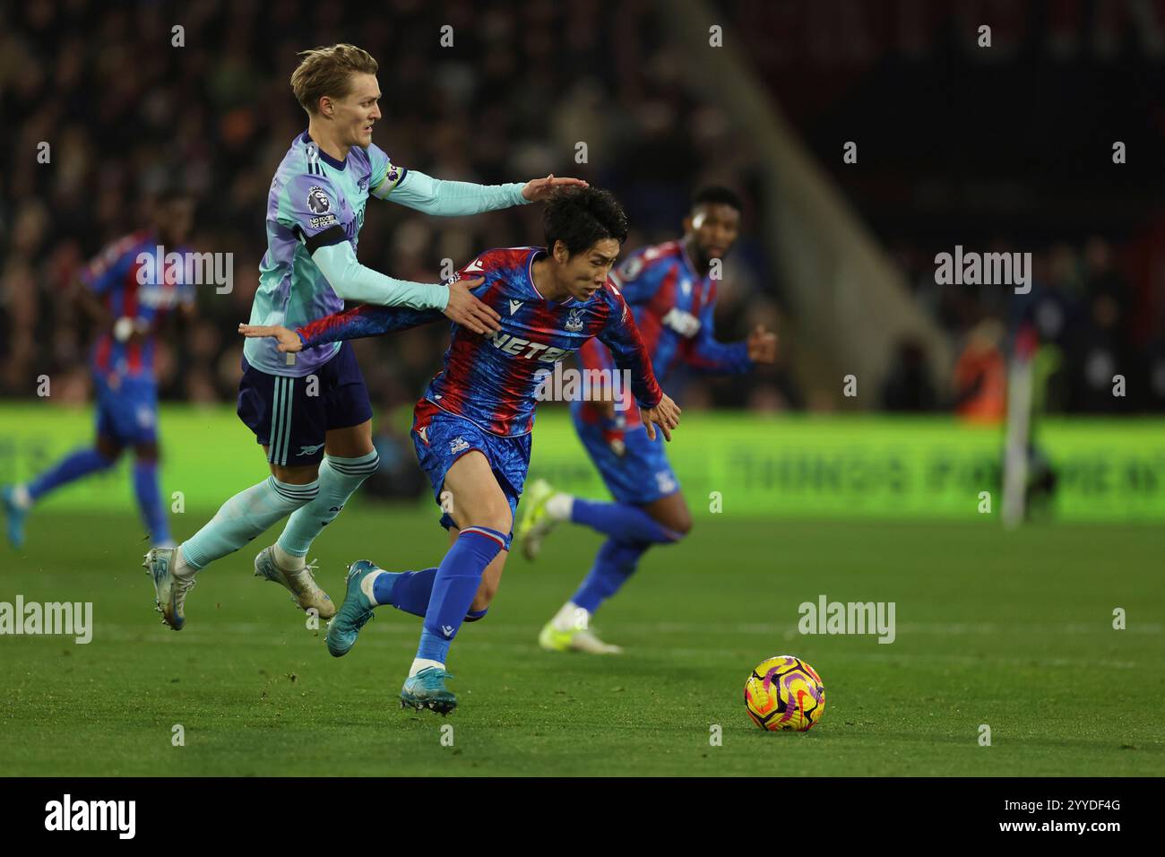 Crystal Palace's Daichi Kamada challenges for the ball withArsenal's ...