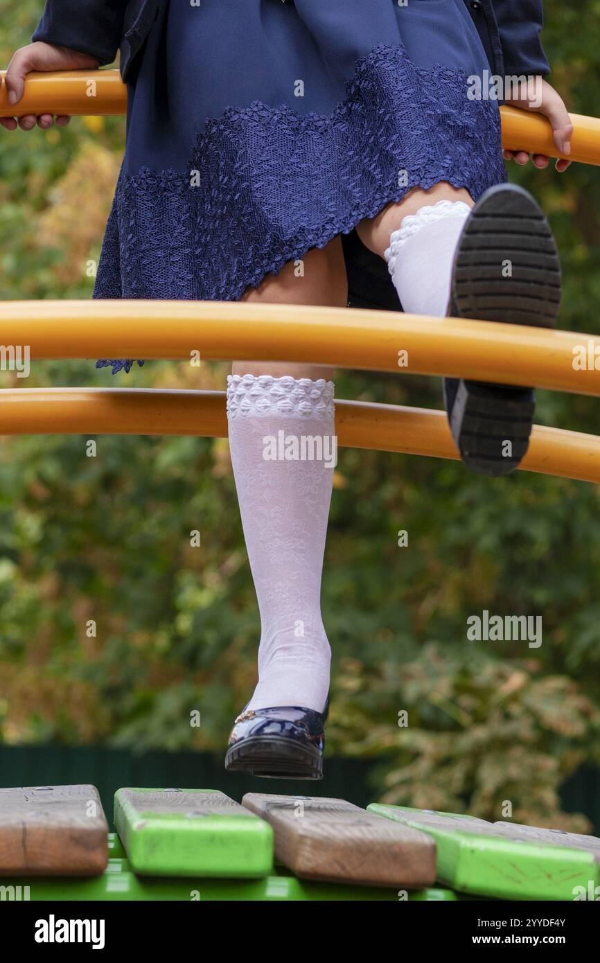 Girl feet on the playground. A child is having fun. feet teenager Stock ...