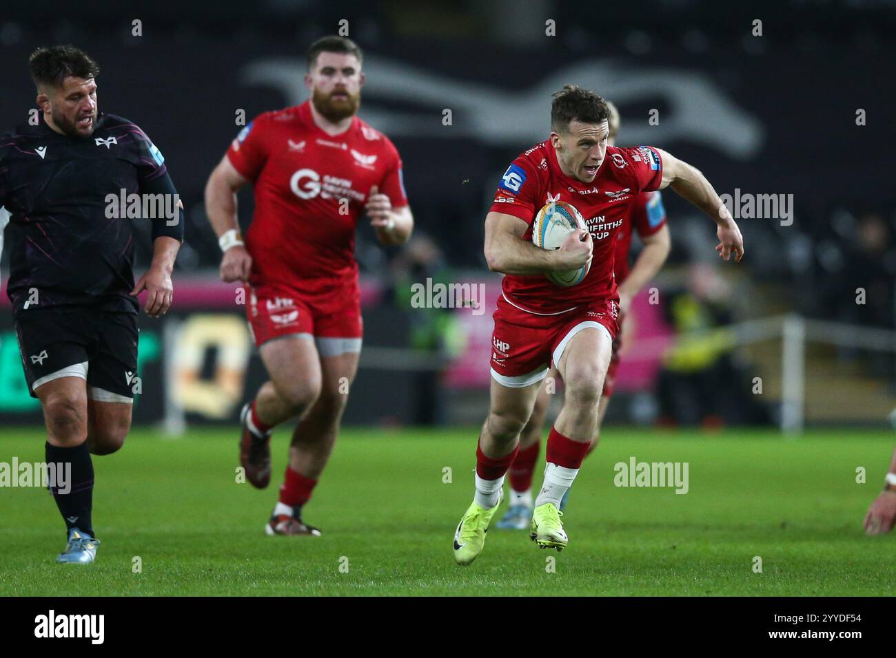 Swansea, UK. 21 December, 2024. Gareth Davies of Scarlets makes a break ...