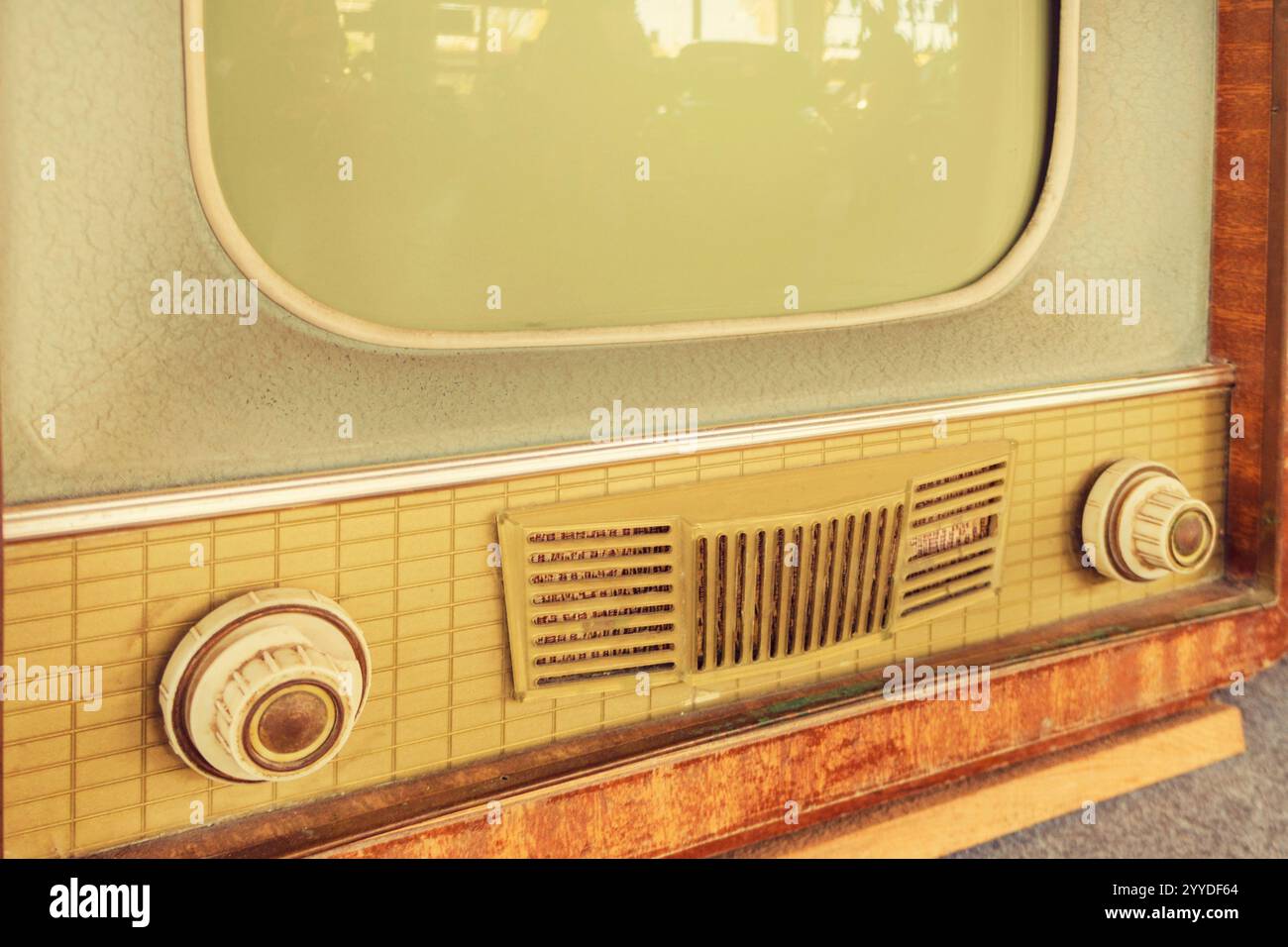 The old TV . The first TV in the world. It is tinted. Vintage ...