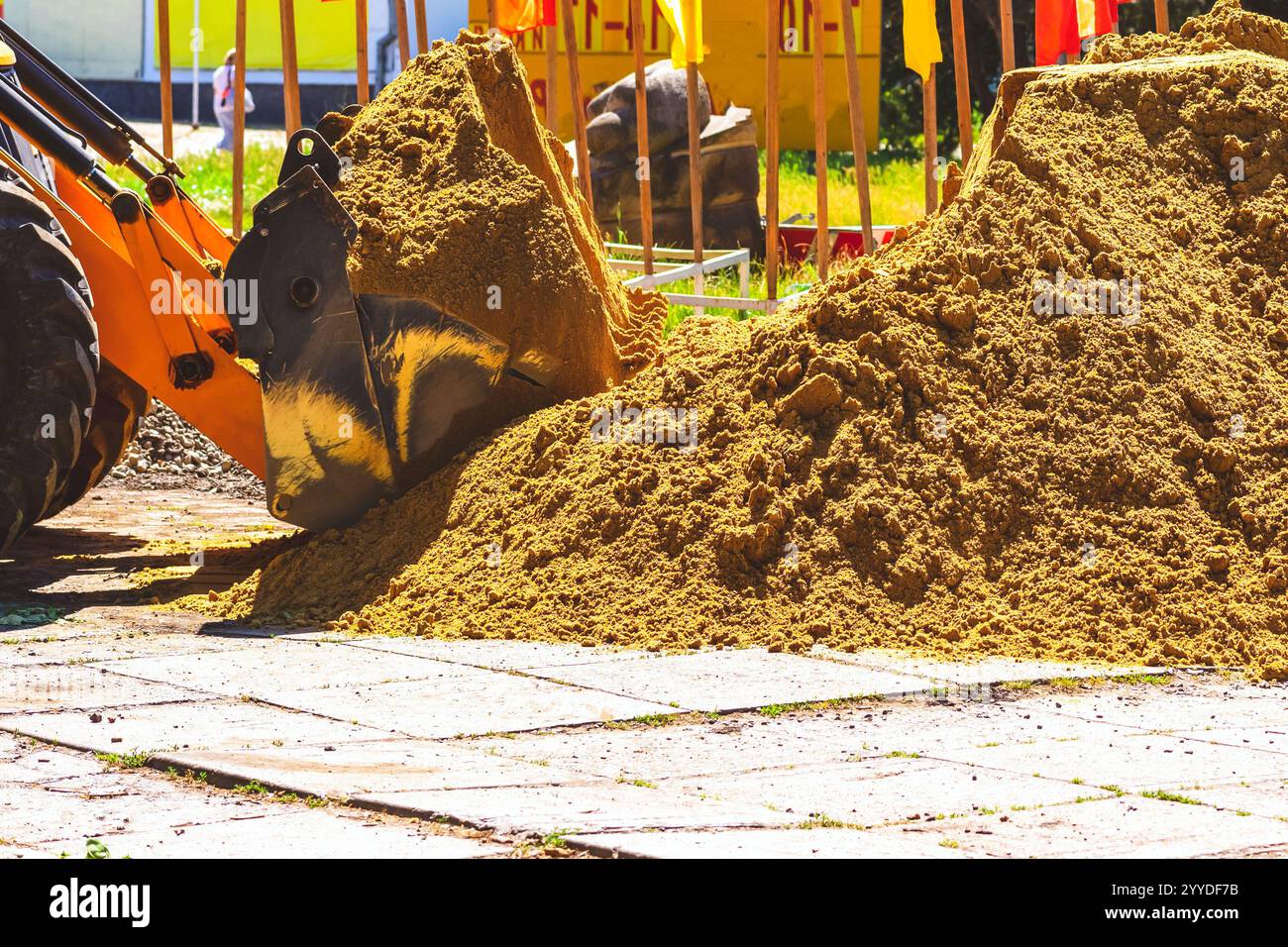 A bucket of the excavator with sand. Concept Road, construction works ...