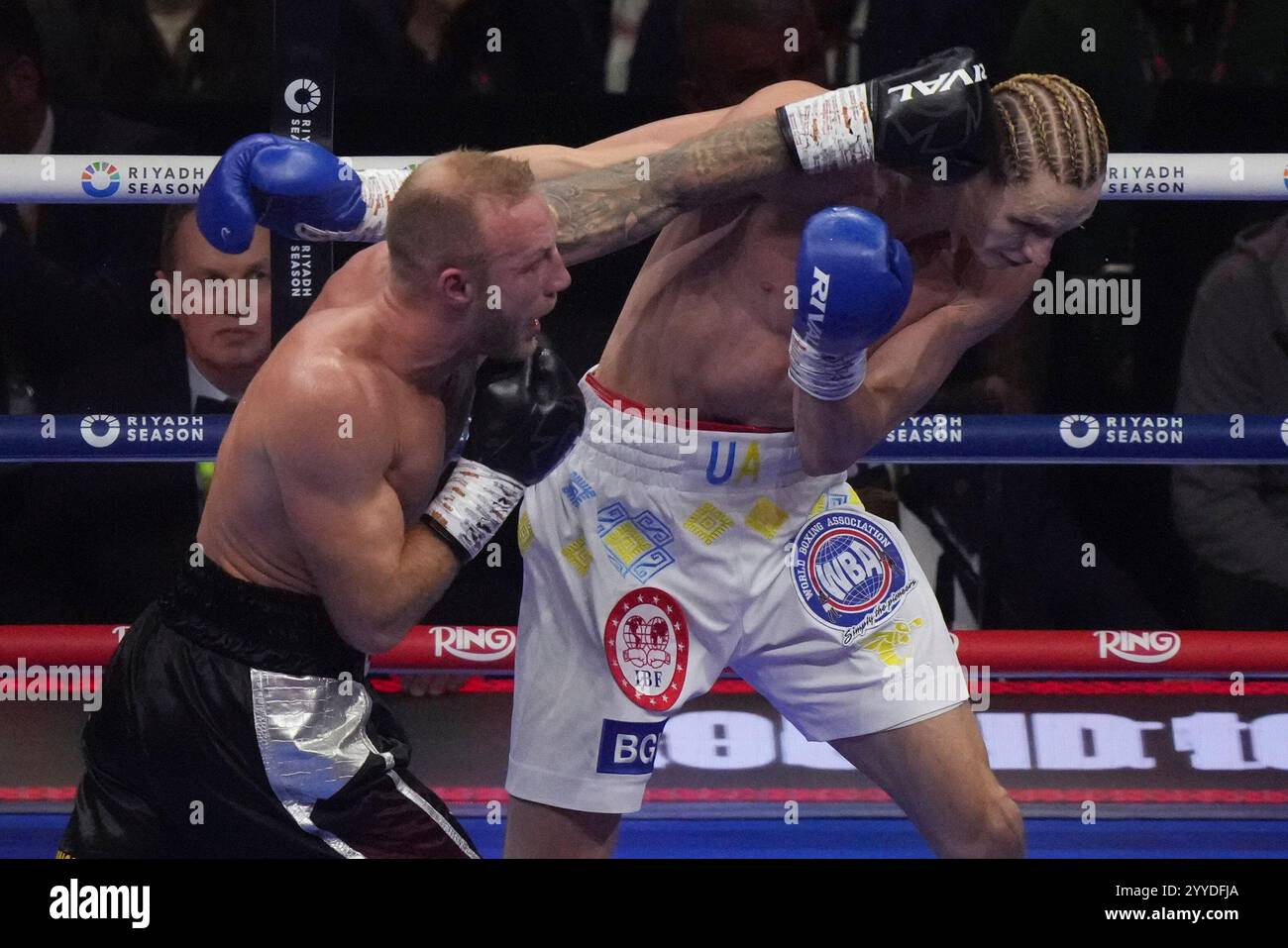 Boxers Ukraine's Daniel Lapin, right, and Dylan Colin of France exchange blows during their ...