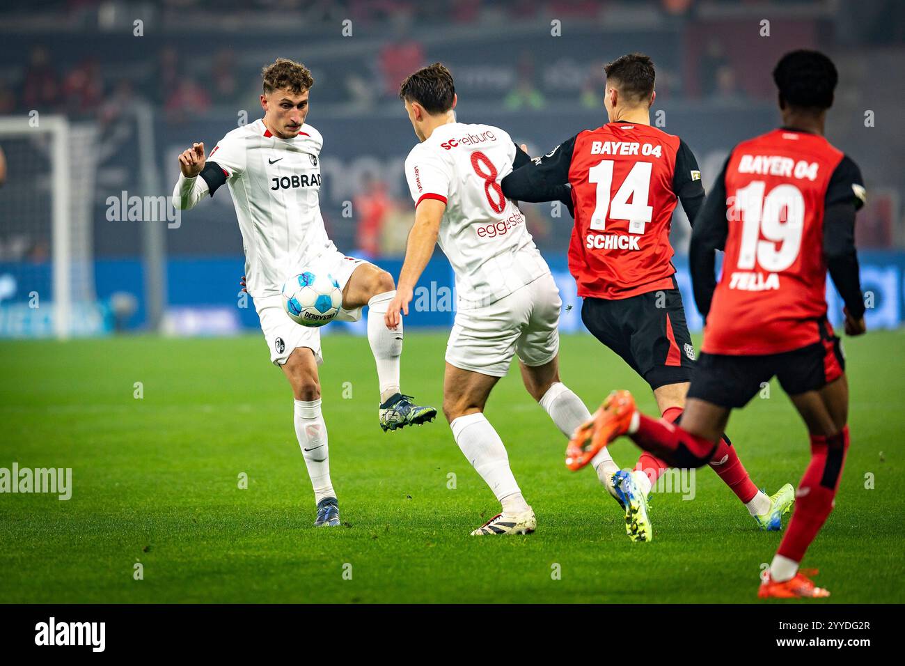 Leverkusen, Deutschland. 21st Dec, 2024. Patrick Osterhage (SC Freiburg, 6), Maximilian ...