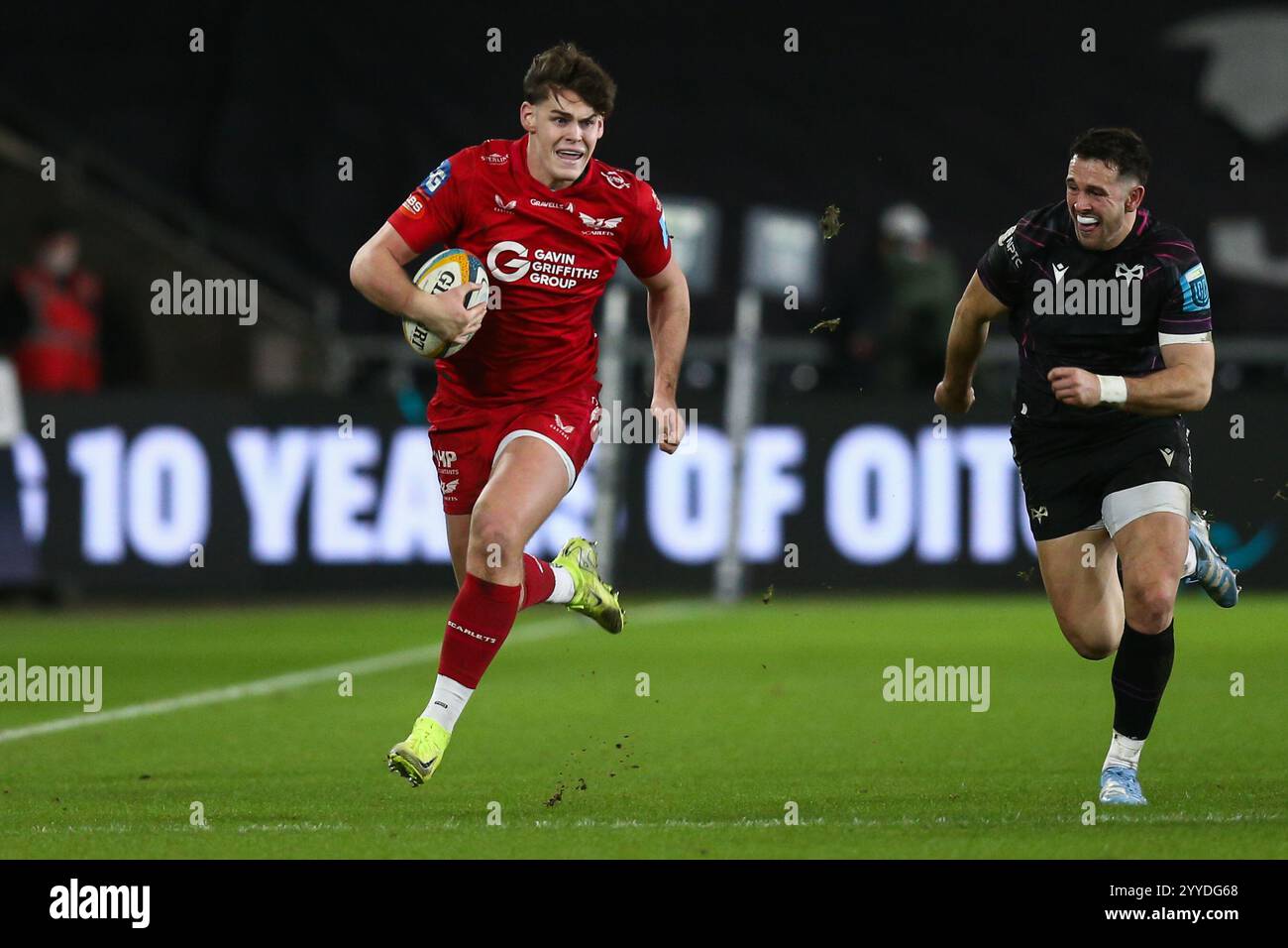 Swansea, UK. 21 December, 2024. Eddie James of Scarlets on the attack during the Ospreys v ...