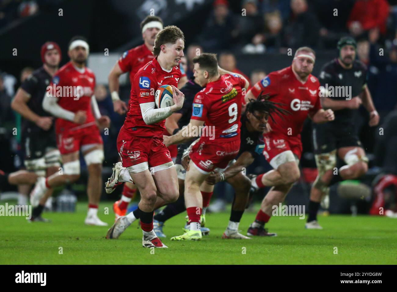 Swansea, UK. 21 December, 2024. Ellis Mee of Scarlets on the way to ...