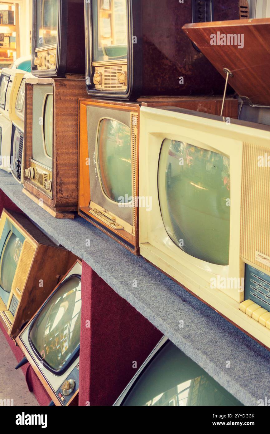 Many retro television. vintage old TV is colorful multi-row. Seeing the ...