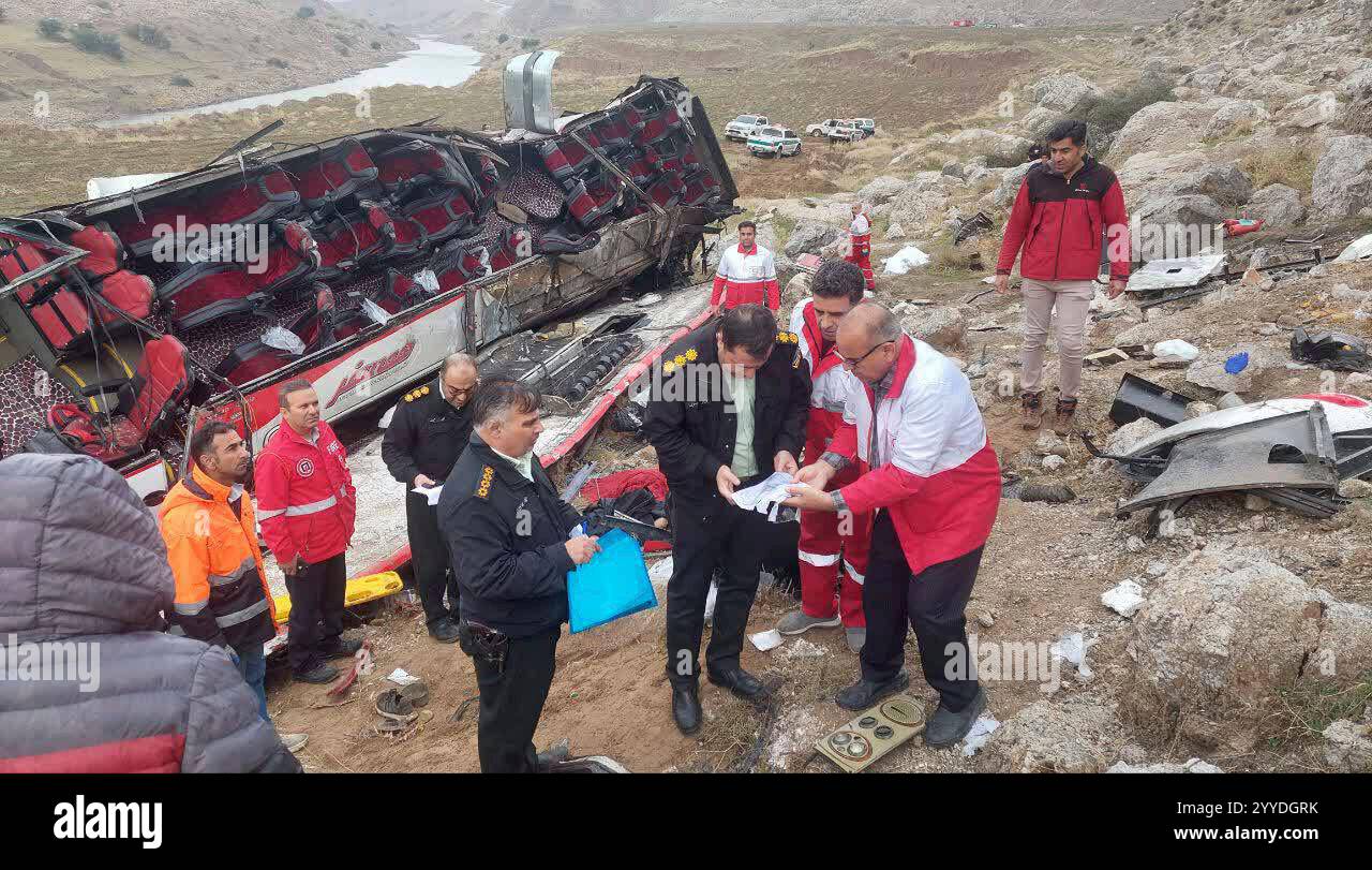 In this photo released by Iranian Red Crescent Society, rescue workers ...