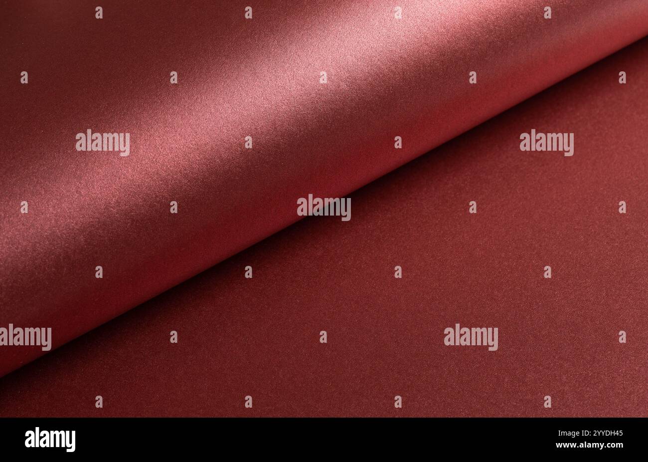 Burgundy red metallic paper texture with a pearlescent sheen and warm ...