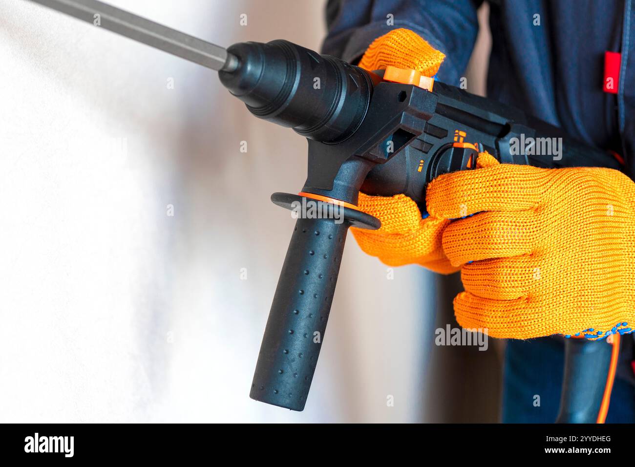 workman switches directions to a rotary hammer. Hands change of ...