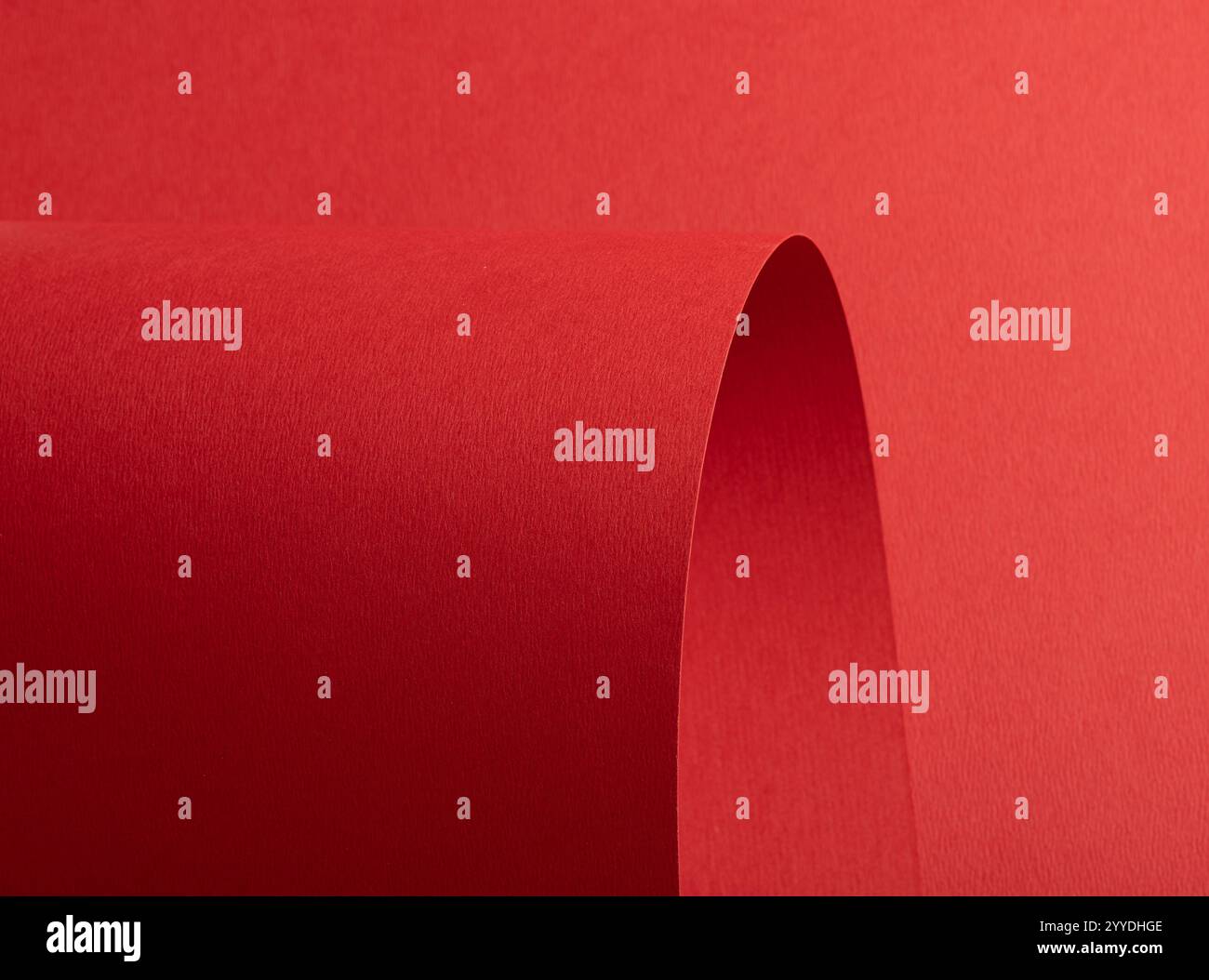 Crimson red paper texture with a curved, tactile surface and matte ...