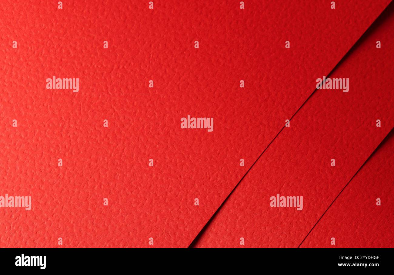 Crimson red paper texture with a grainy, perforated surface and smooth ...