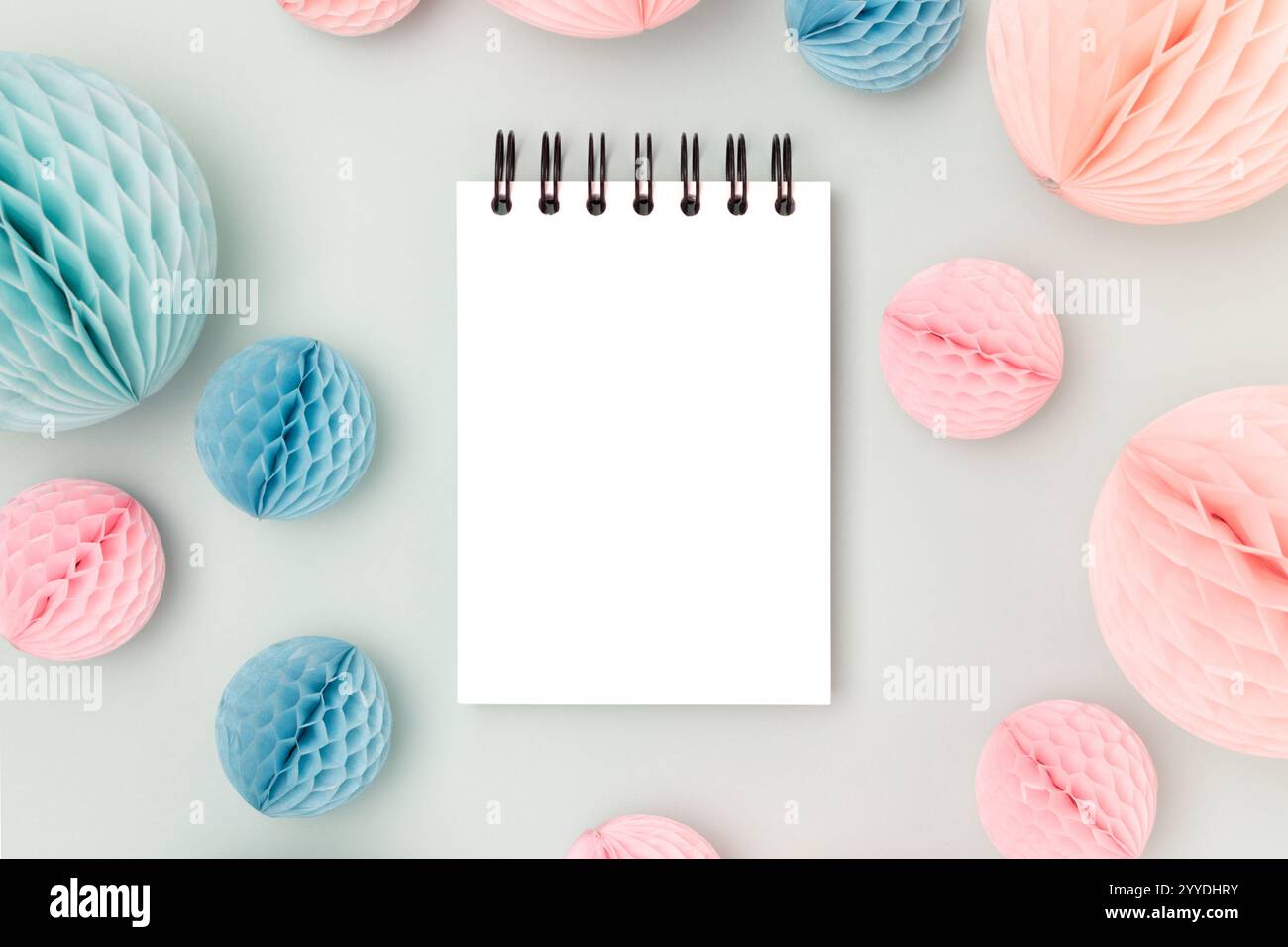 Empty notepad mockup and tissue paper balls in a blue and pink colors ...