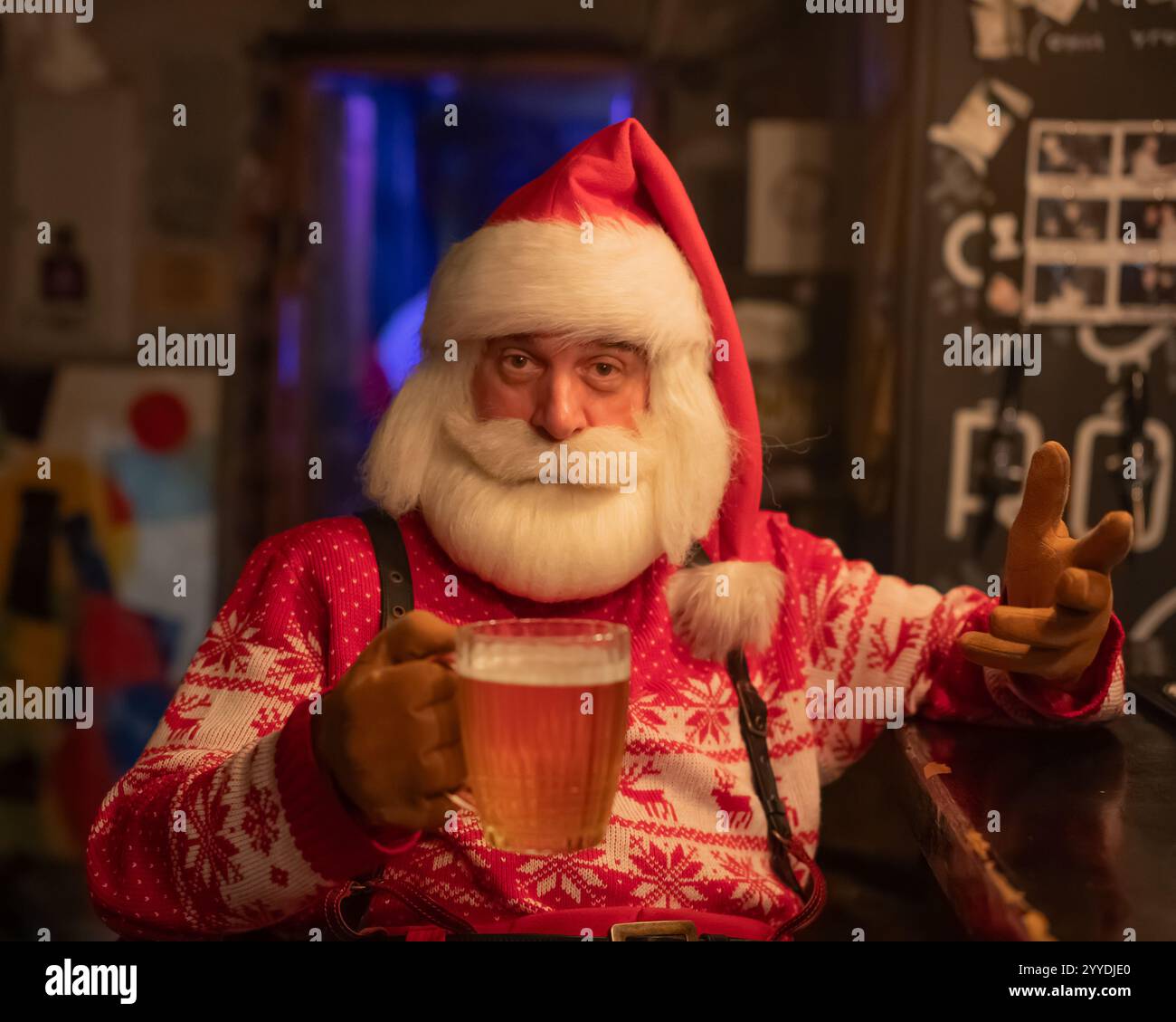 Santa Claus drinking beer at a bar Stock Photo - Alamy