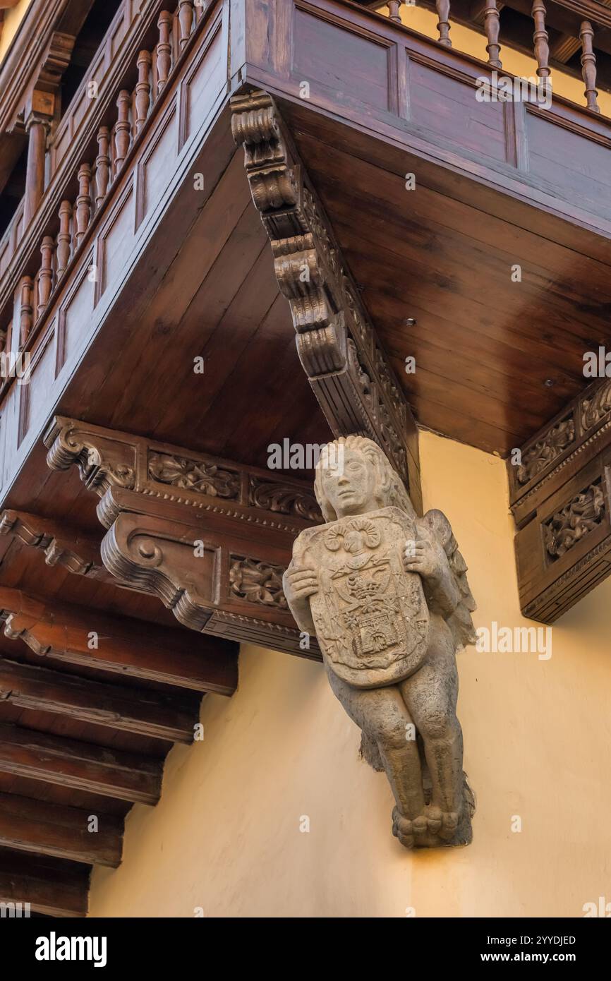 Medieval stone sculpture on the balcony of the Casa del Colon house ...