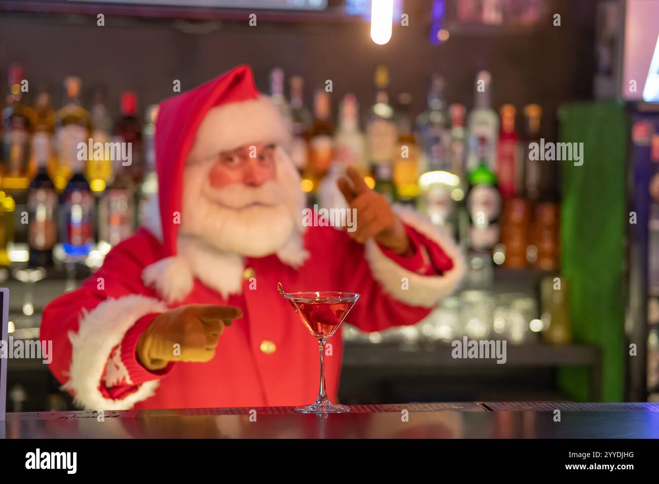 Bartender dressed as Santa Claus makes strawberry cocktail in pub Stock ...