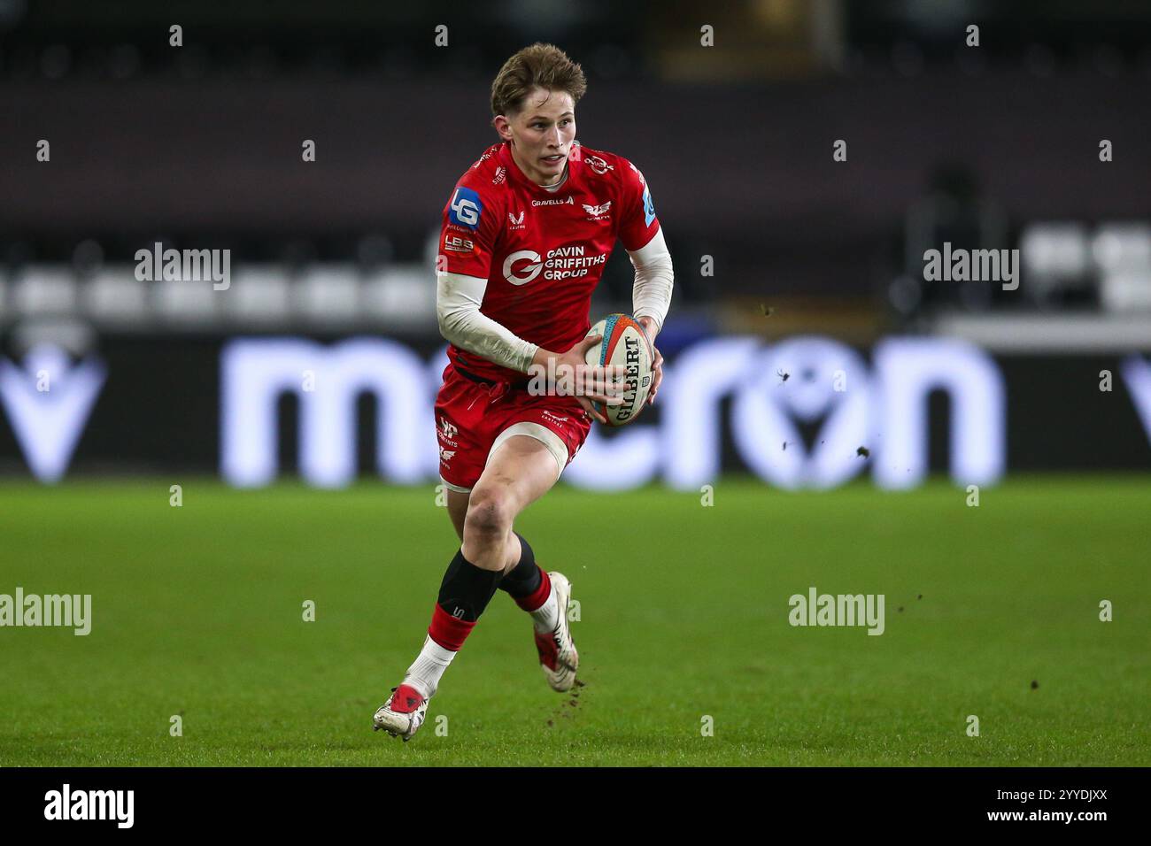 Swansea, UK. 21 December, 2024. Ellis Mee of Scarlets makes a break ...