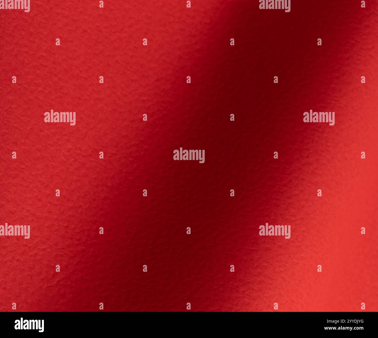 Rich scarlet paper texture with a grainy, perforated surface and soft ...