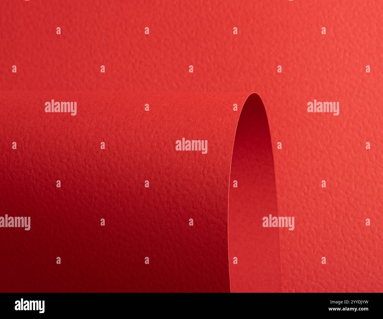 Scarlet red paper texture with a grainy, perforated surface featuring ...