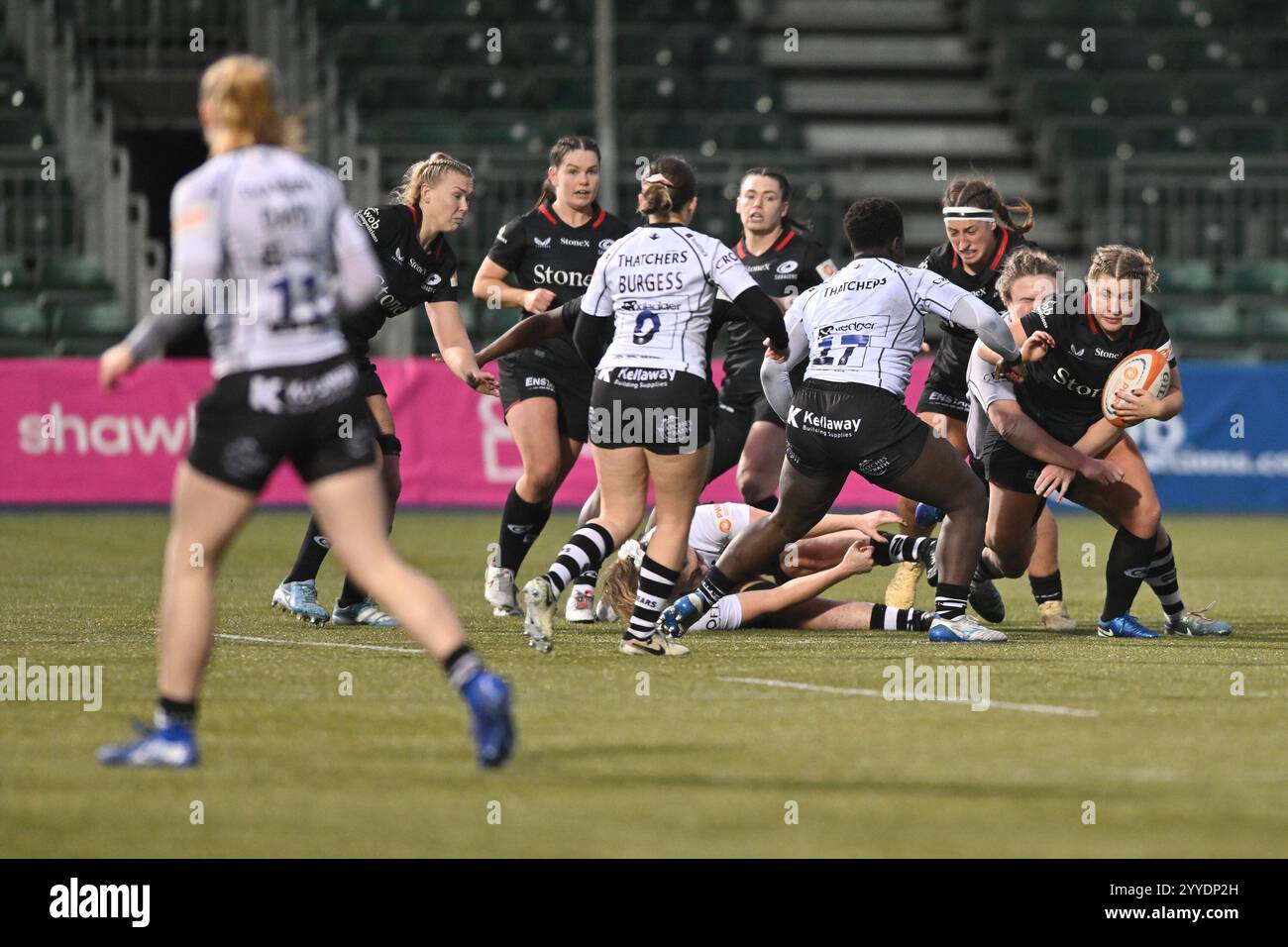 May Campbell of Saracens Women drives forward with the ball as Simi Pam ...