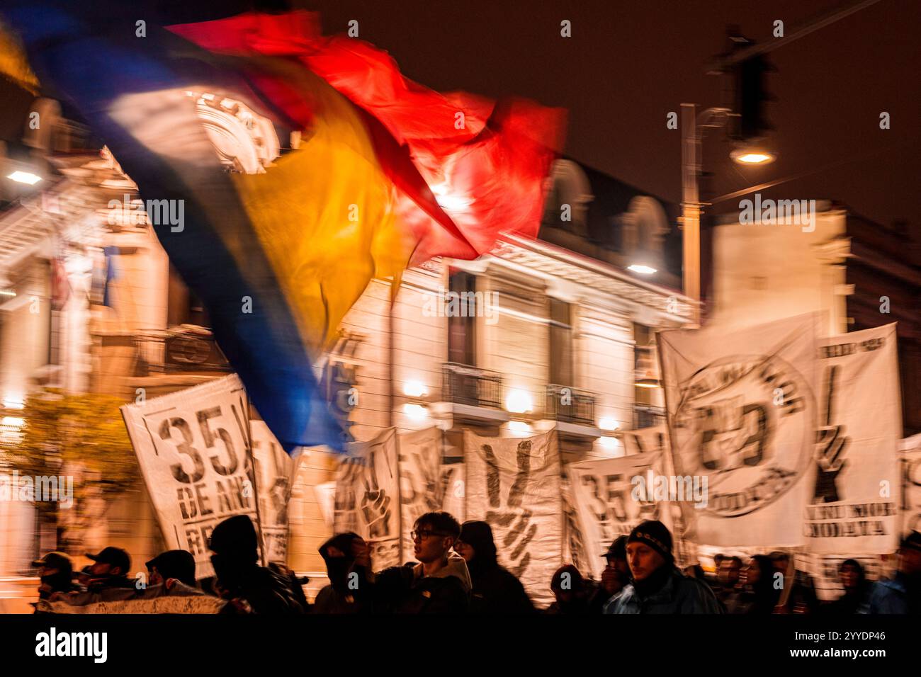 People walk waving flags and holding banners during and event dubbed ...