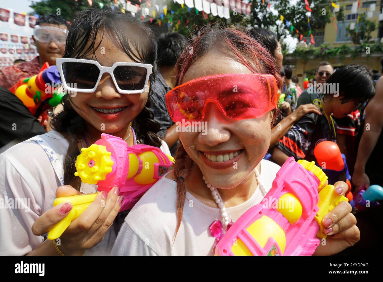Bangkok, Thailand - April 13, 2023: People splash water in each other using water guns during ...