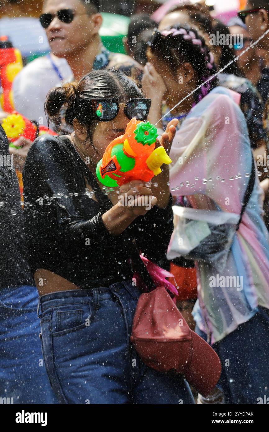 Bangkok, Thailand - April 13, 2023: People splash water in each other ...