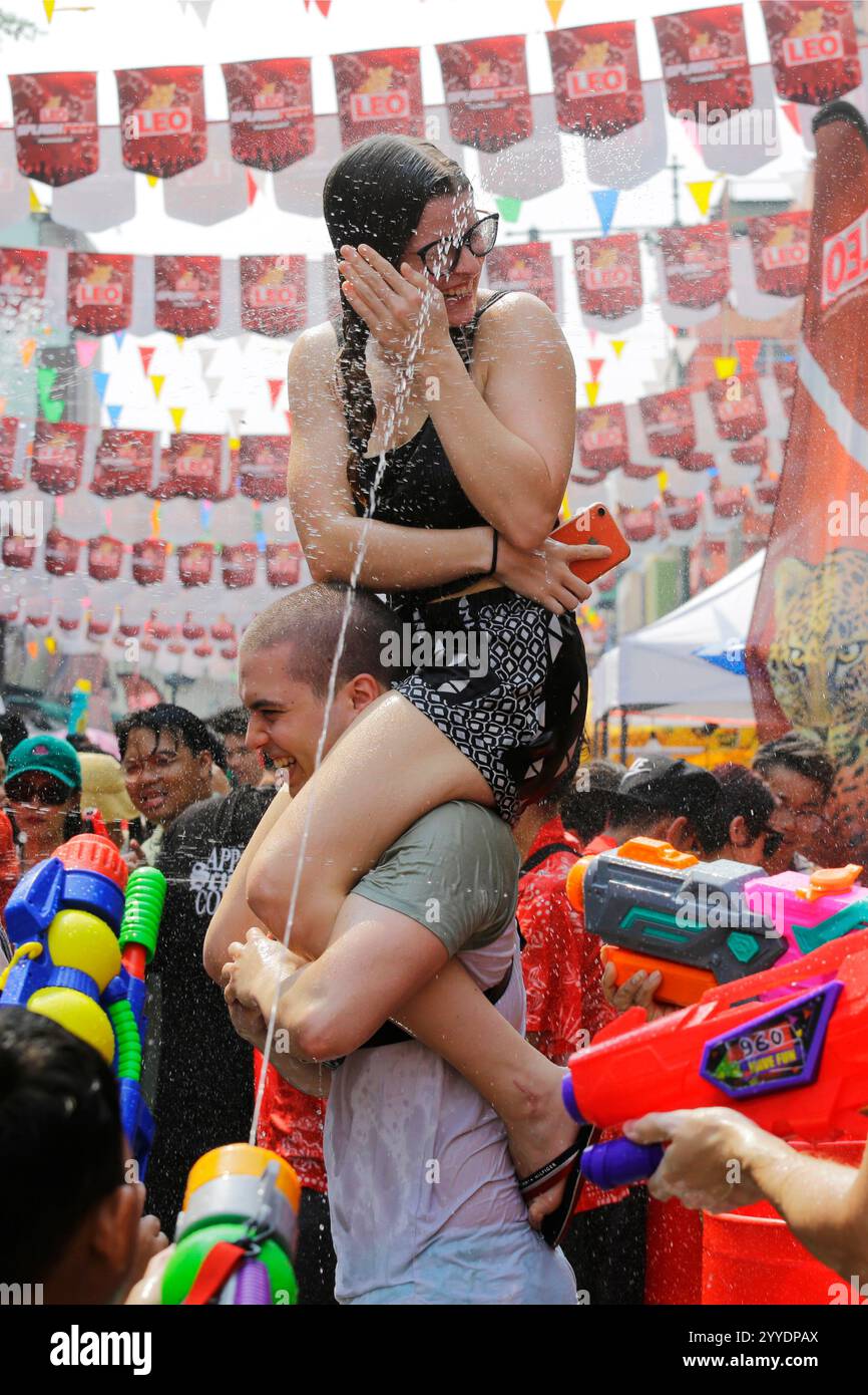 Bangkok, Thailand - April 13, 2023: People splash water in each other using water guns during ...