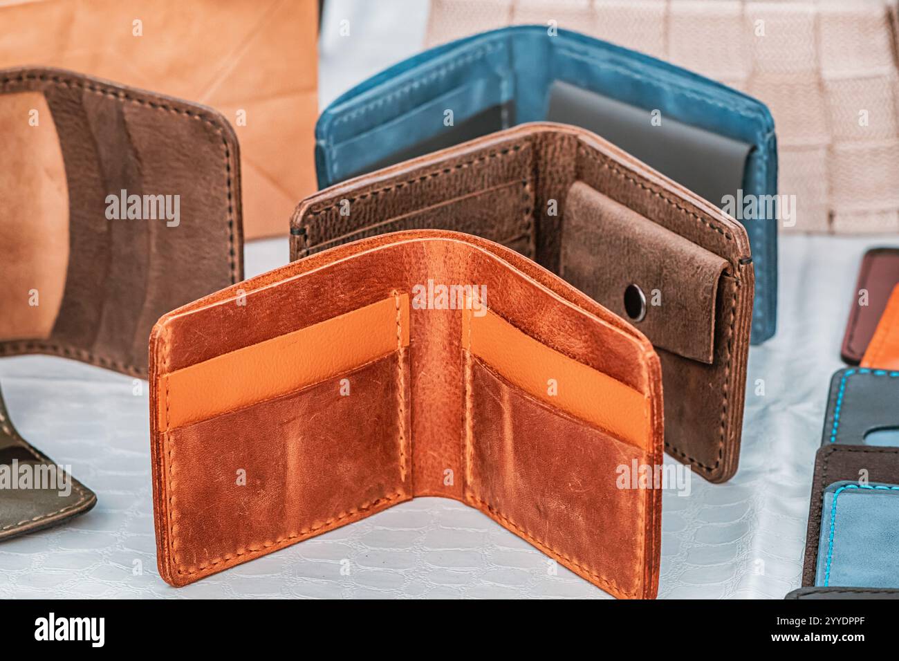 A stylish leather wallets on a flat surface, empty of cash but ready ...