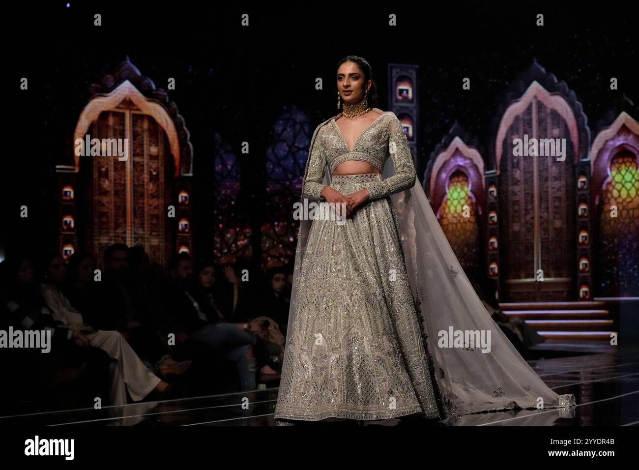 A model presents a creation from designer Basit Sipra during a fashion ...