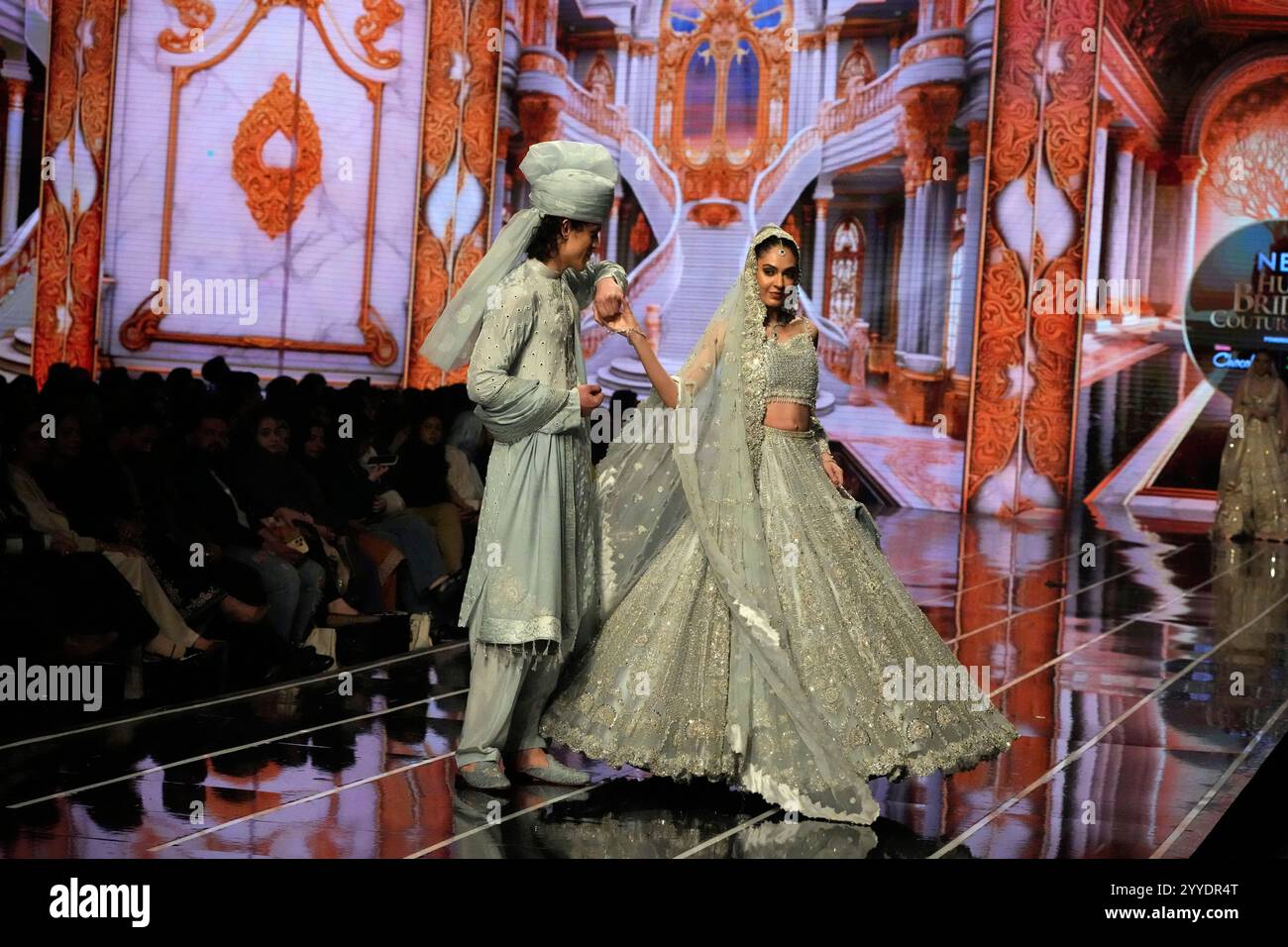 Models present a creation from designer Hafsa Imran Khan during a ...