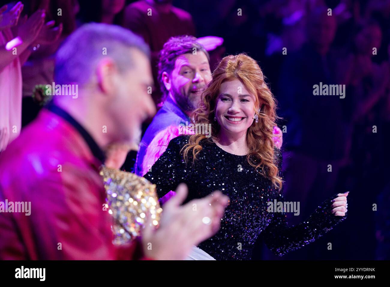 Cologne, Germany. 21st Dec, 2024. Rea Garvey (back) and Palina Rojinski ...