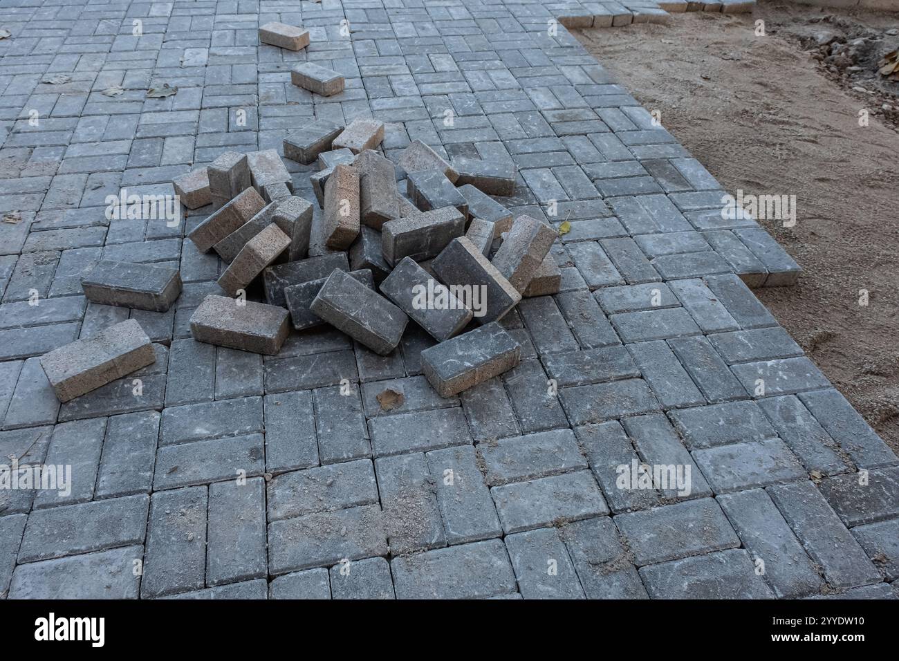 Process of installing paving bricks in the town pedestrian zone. Laying ...