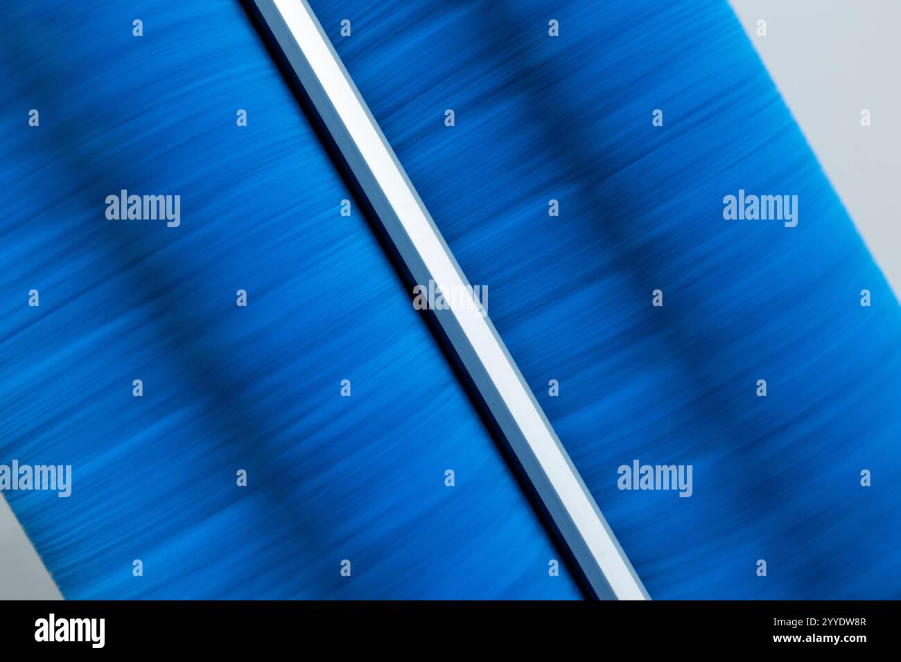 Spinning blue cylindrical counter-rotating brushes on the bottom of a ...