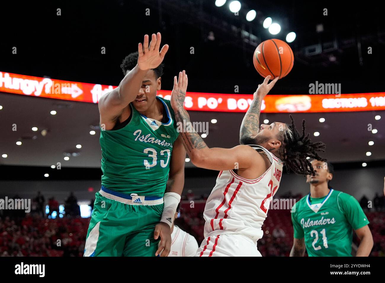 Houston's Emanuel Sharp (21) shoots as Texas A&M-Corpus Christi's Garry ...