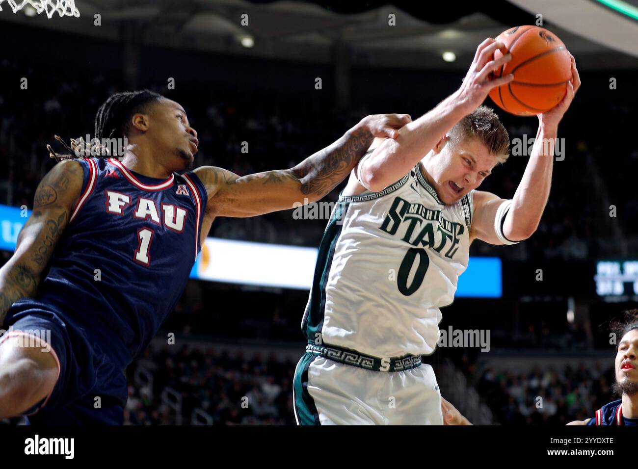 Michigan State forward Jaxon Kohler, right, pulls down a rebound ...
