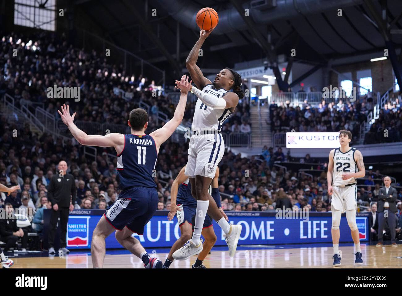 Butler forward Jahmyl Telfort (11) shoots over Connecticut forward Alex ...