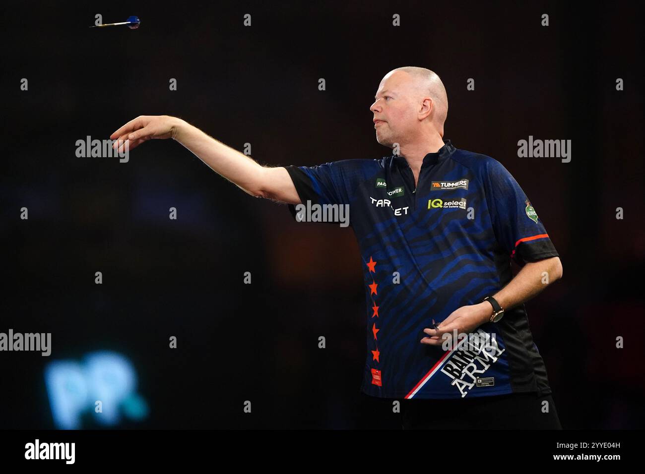 Raymond van Barneveld in action during his second round match against ...