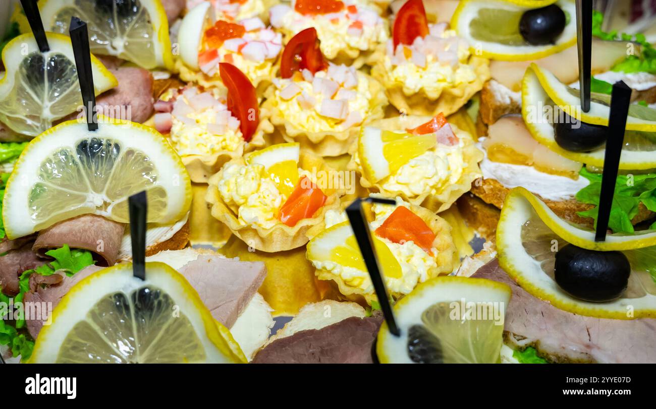 A vibrant platter displays an assortment of appetizers, including ...