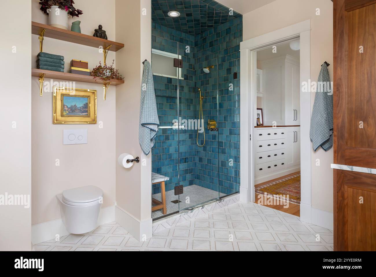Bathroom showing shower and wall mounted toilet and view into walk-in ...